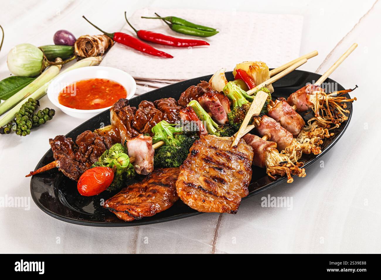Asian grilled skewer assortment satay with beef, porl, chicken and ...