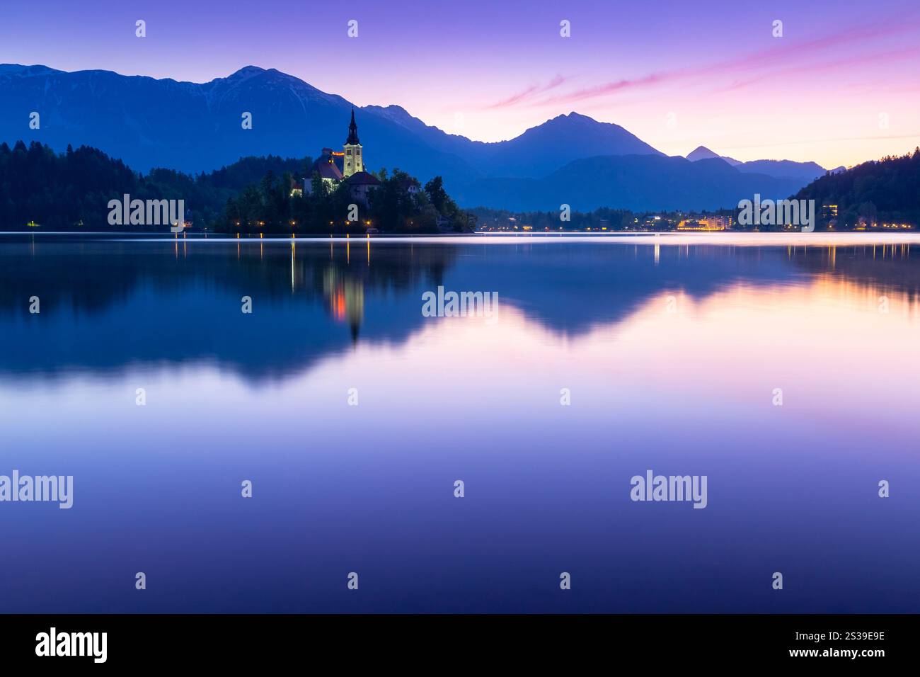 View of lake Bled at in spring with the small island and Assumption of ...