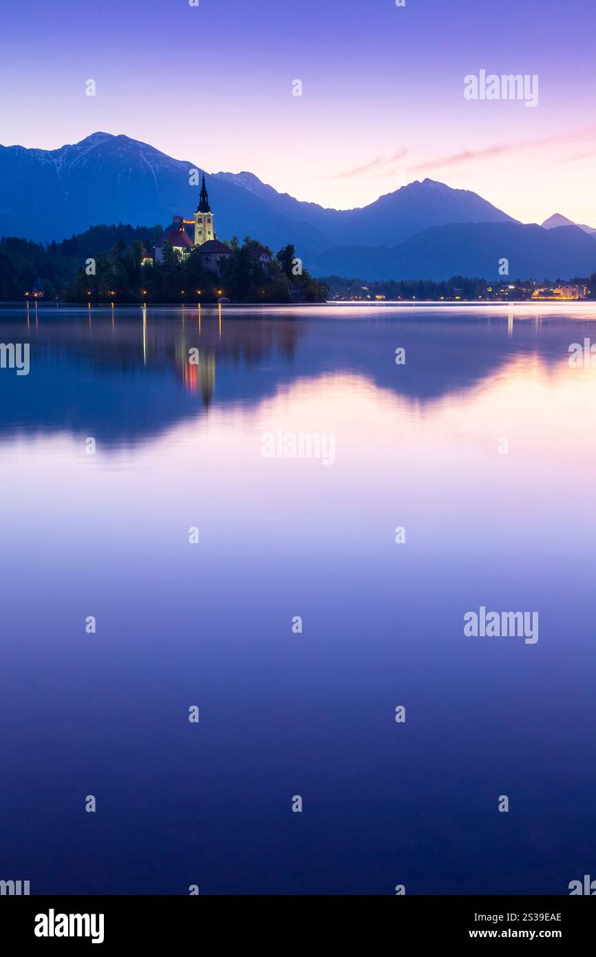 View of lake Bled at in spring with the small island and Assumption of ...