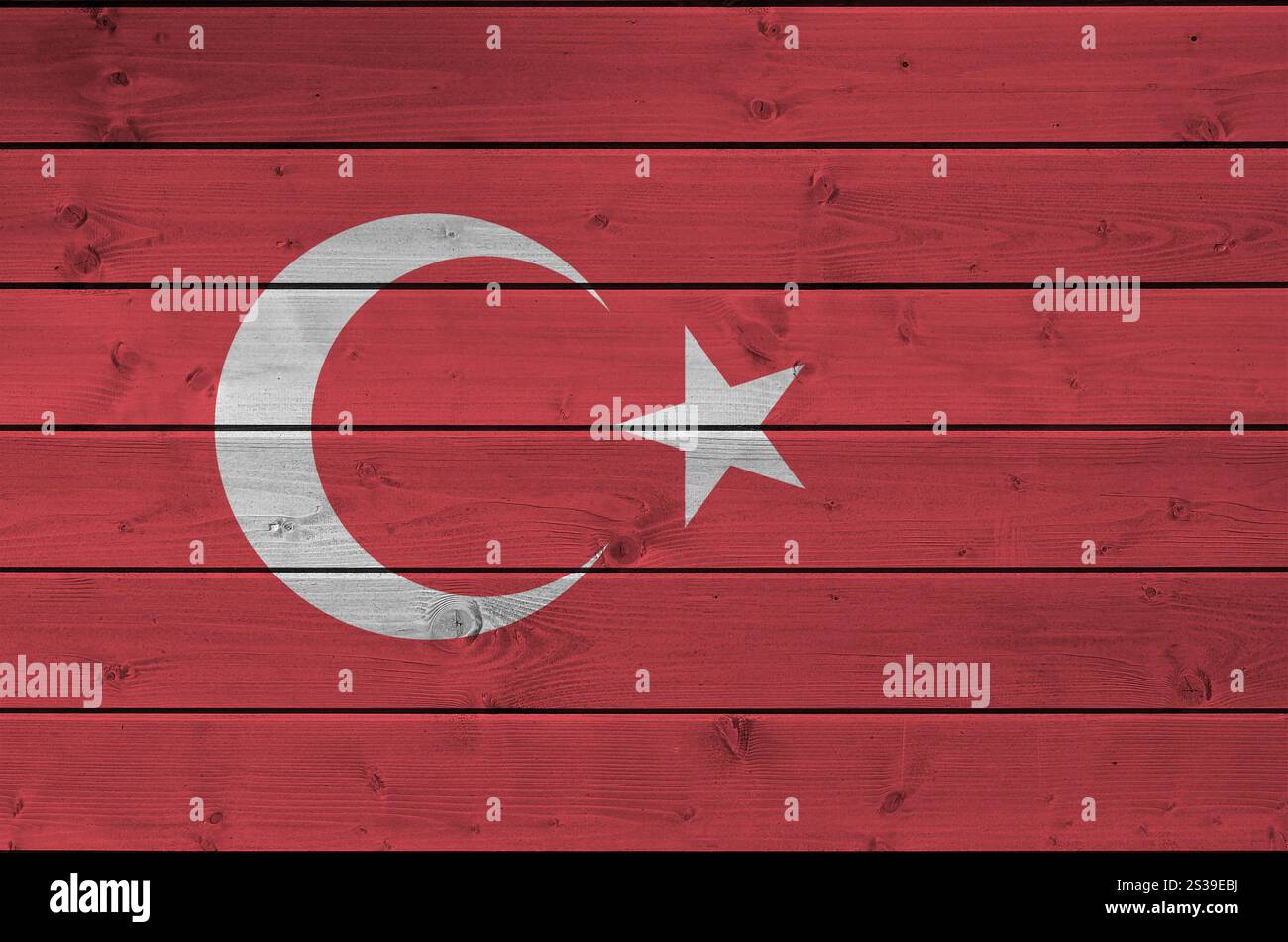 Turkey flag depicted in bright paint colors on old wooden wall close up ...