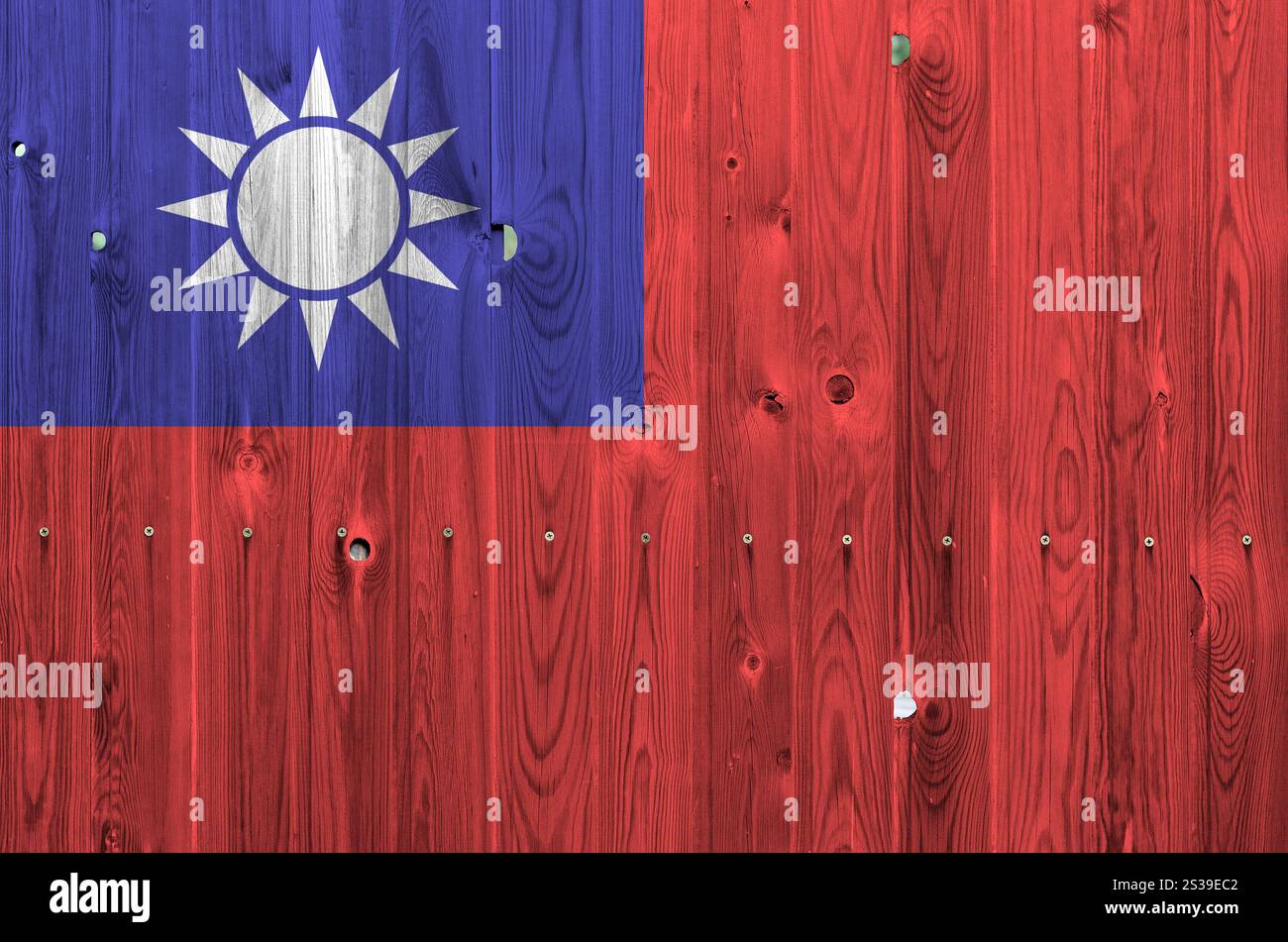 Taiwan flag depicted in bright paint colors on old wooden wall close up ...
