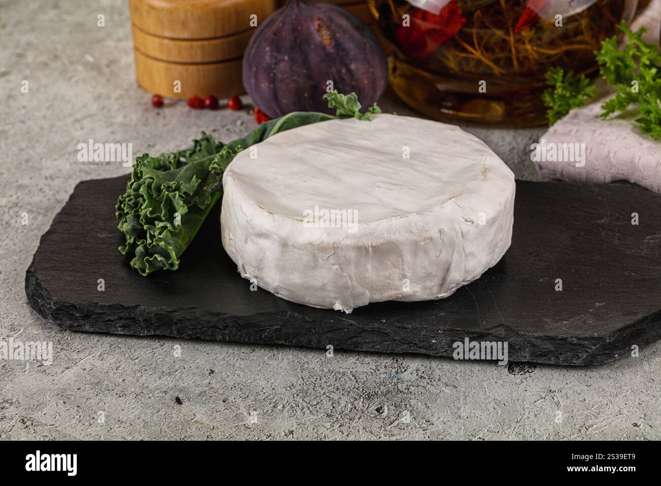 Gourmet round creamy Camembert cheese served fig Stock Photo - Alamy