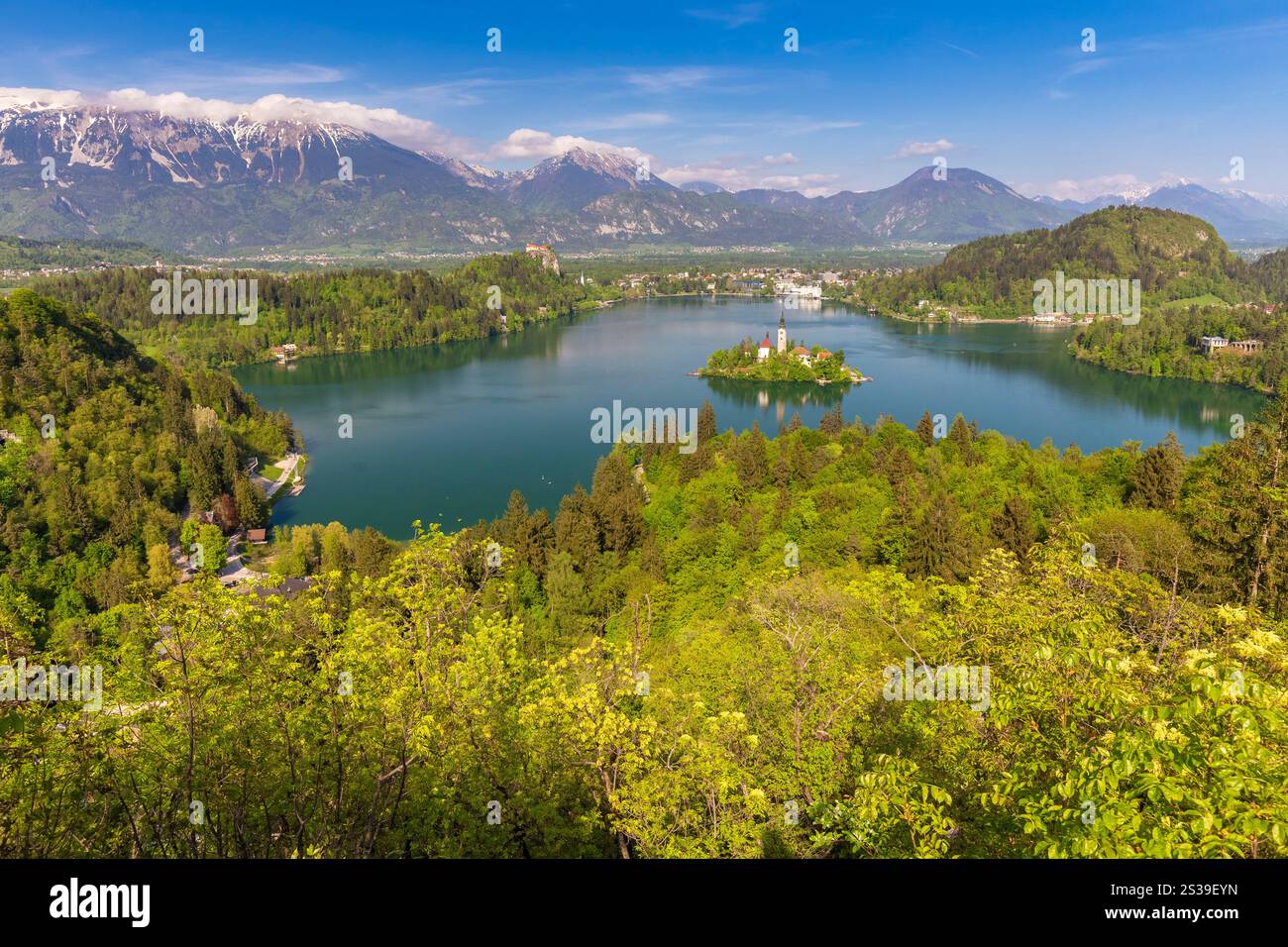 View of lake Bled at in spring with the small island and Assumption of ...