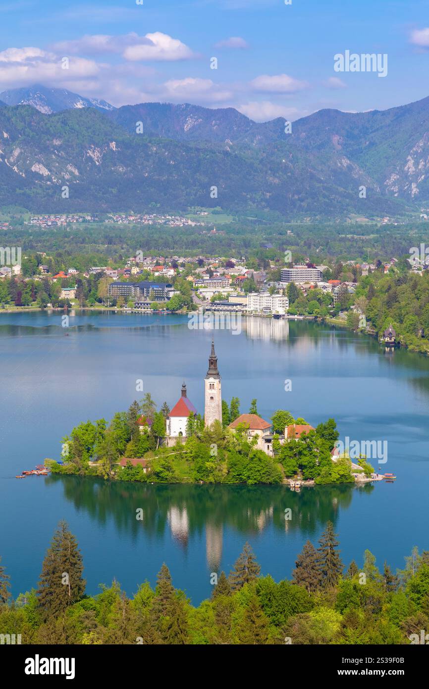 View of lake Bled at in spring with the small island and Assumption of ...