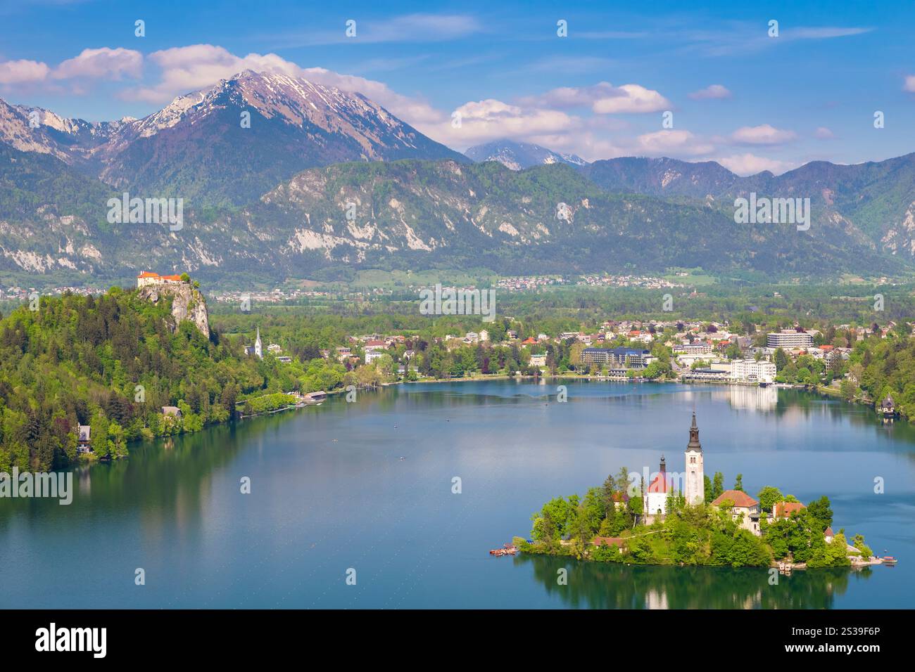 View of lake Bled at in spring with the small island and Assumption of ...
