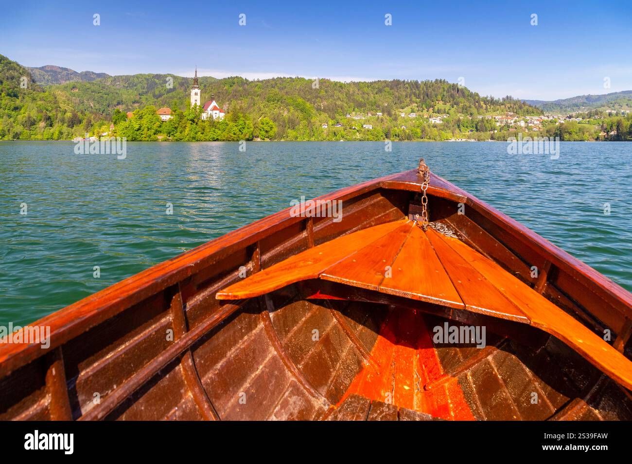 View of Bled church and island on Lake Bled from a typical boat. Bled ...