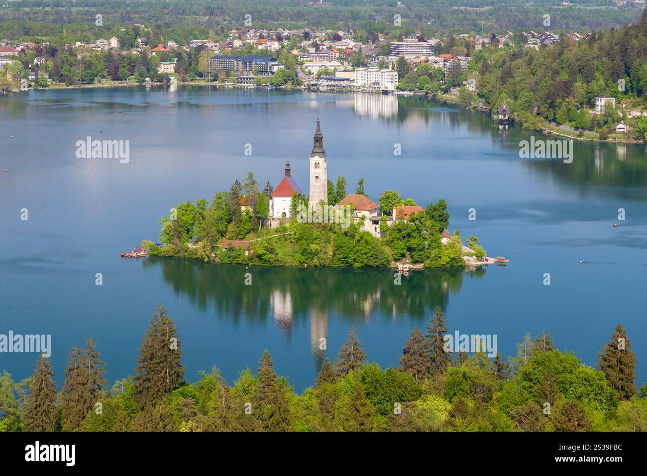 View of lake Bled at in spring with the small island and Assumption of ...