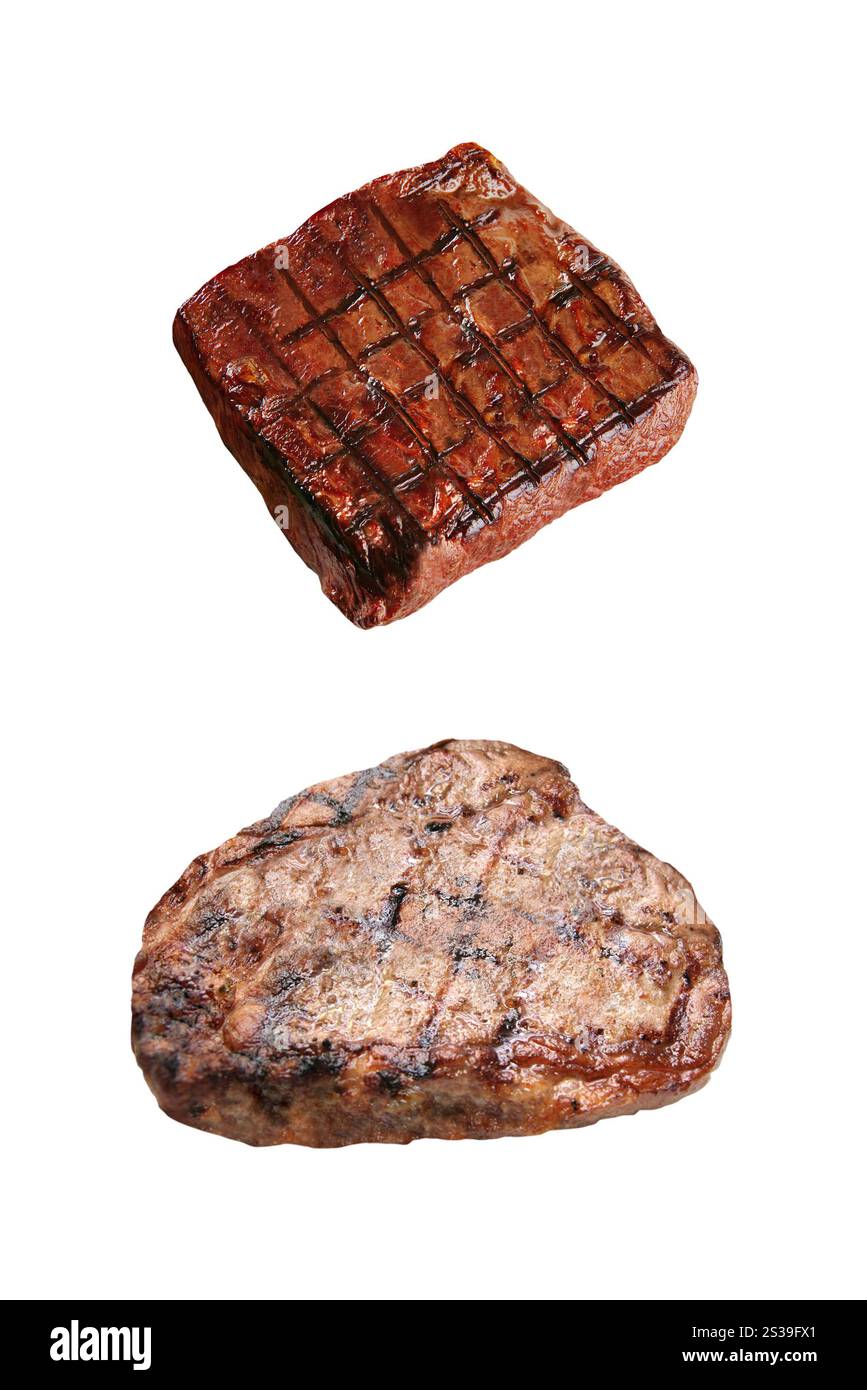 two grilled boneless rib eye steaks isolated on white background. two ...