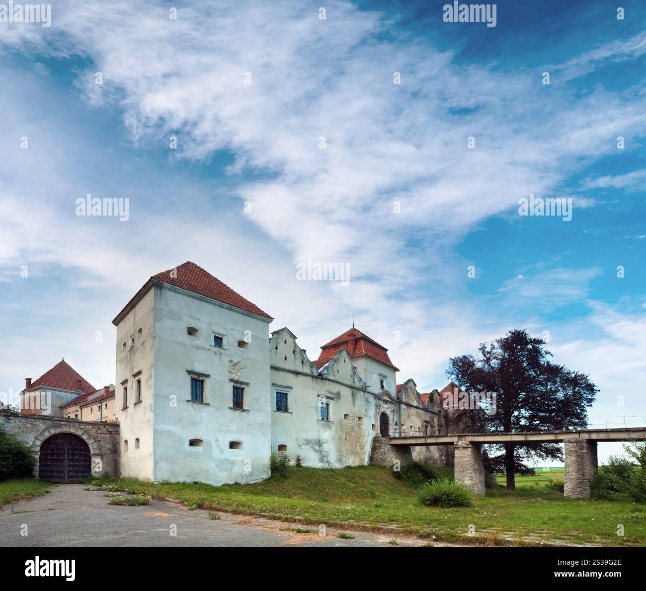 Summer evening view of Svirzh Castle (Lviv Oblast, Ukraine. Built in XV-XVII th century Stock ...