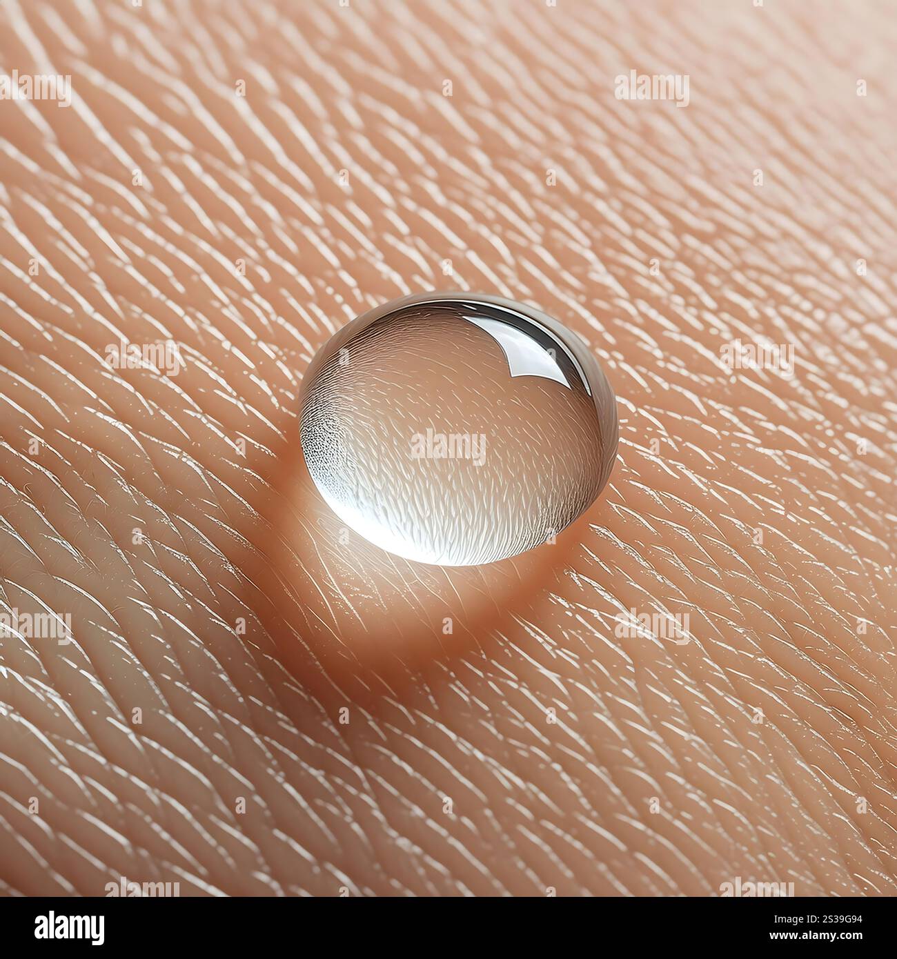 Close-up view of a persons skin with a single drop of water glistening ...