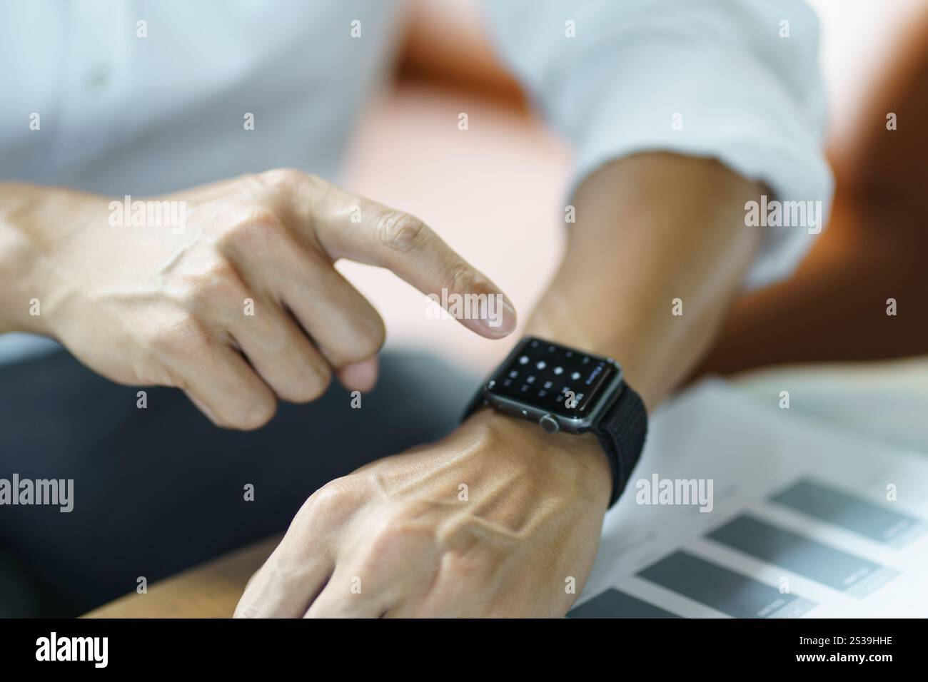 Business man Looking at smart watch In Office online connect Gadget ...