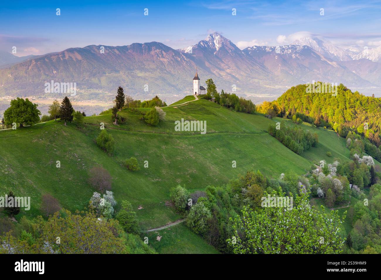 The iconic Jamik church, with Mount Triglav on the background at ...