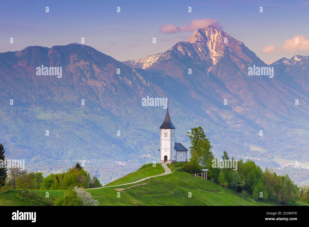 The iconic Jamik church, with Mount Triglav on the background at ...