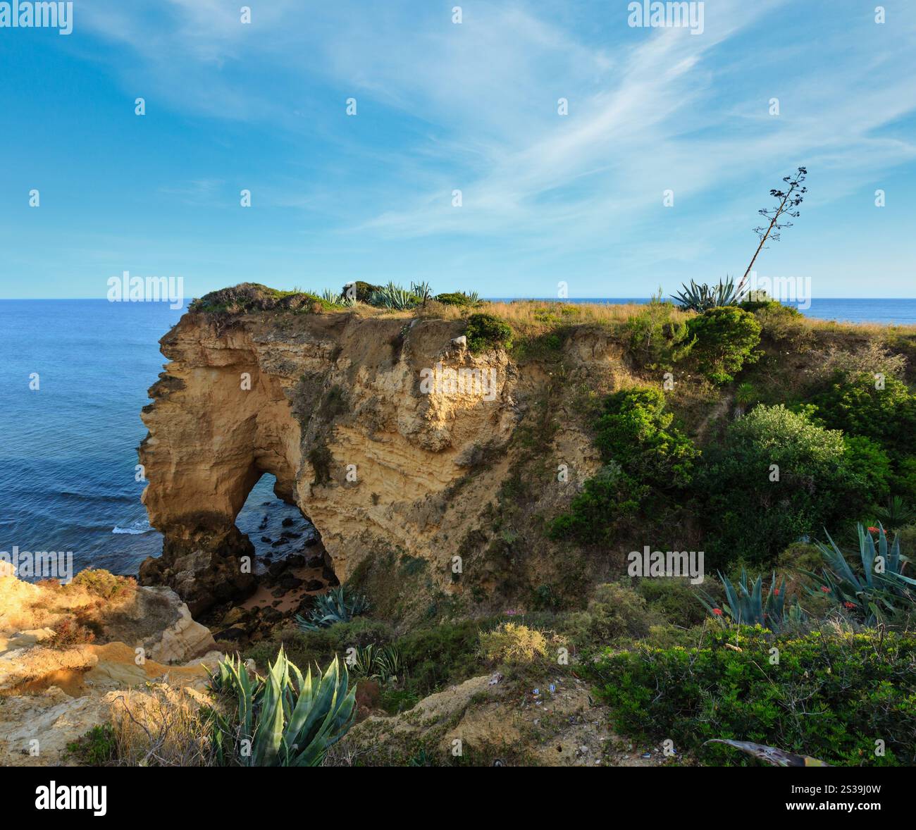 Summer Atlantic ocean coast view with rock formations (Porches, Lagoa ...