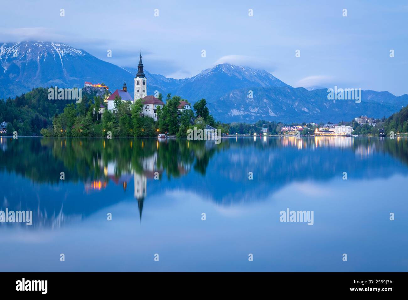 View of lake Bled at in spring with the small island and Assumption of ...