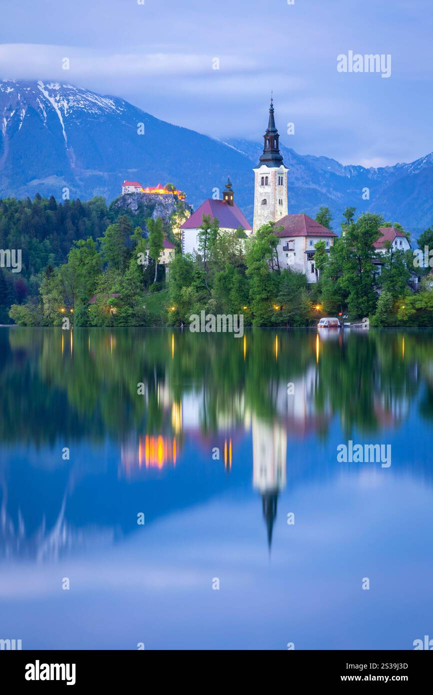 View of lake Bled at in spring with the small island and Assumption of ...
