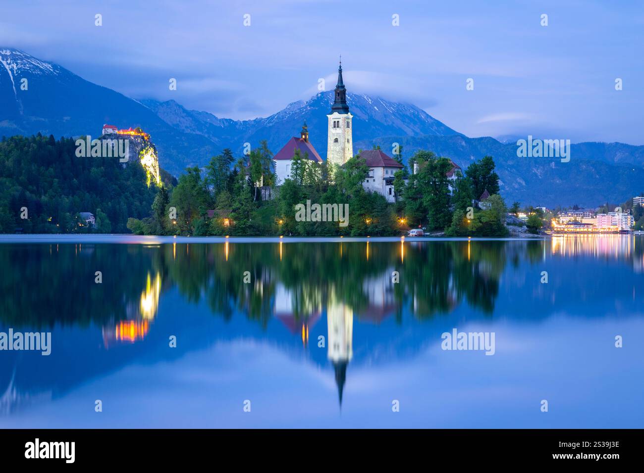 View of lake Bled at in spring with the small island and Assumption of ...
