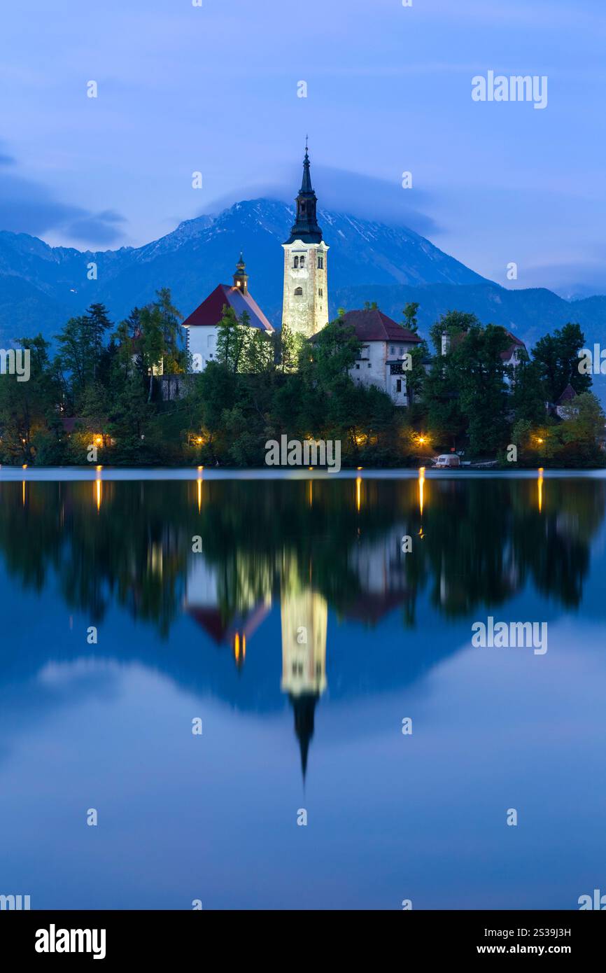 View of lake Bled at in spring with the small island and Assumption of ...