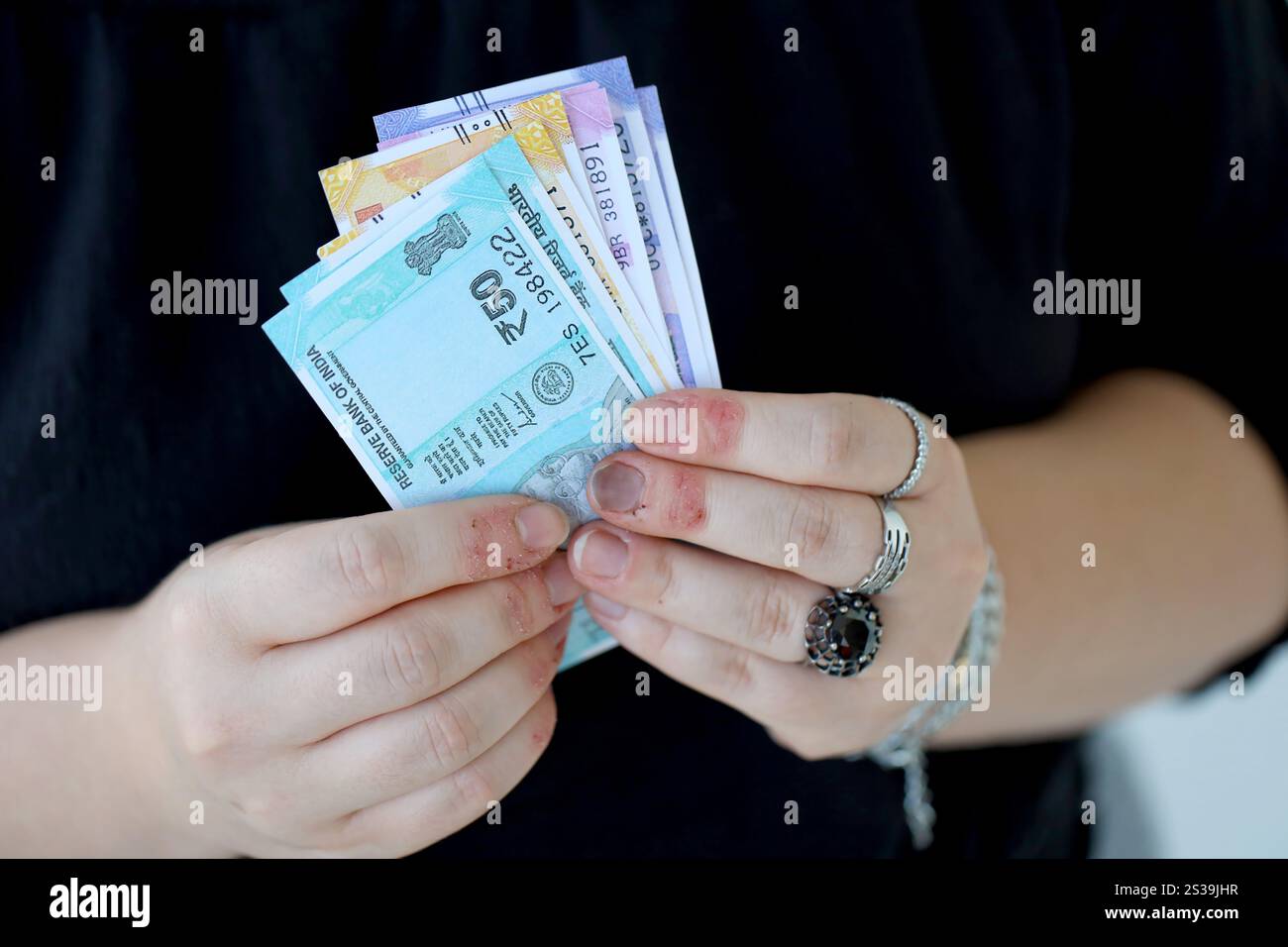 Woman hand with indian rupees bills close up. Concept of financial ...