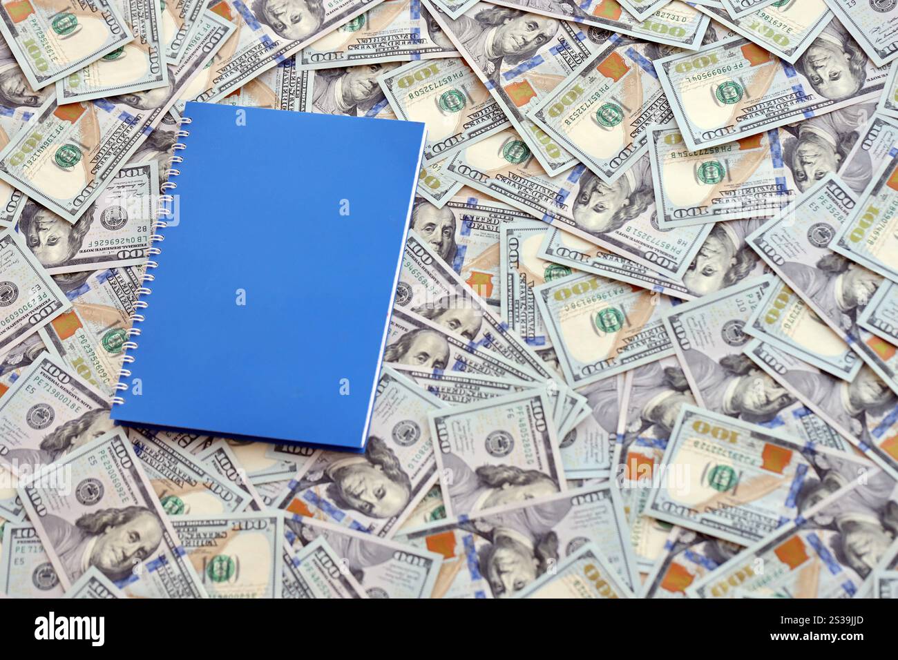 Office workplace table with blank notebook or notepad and many hundred ...