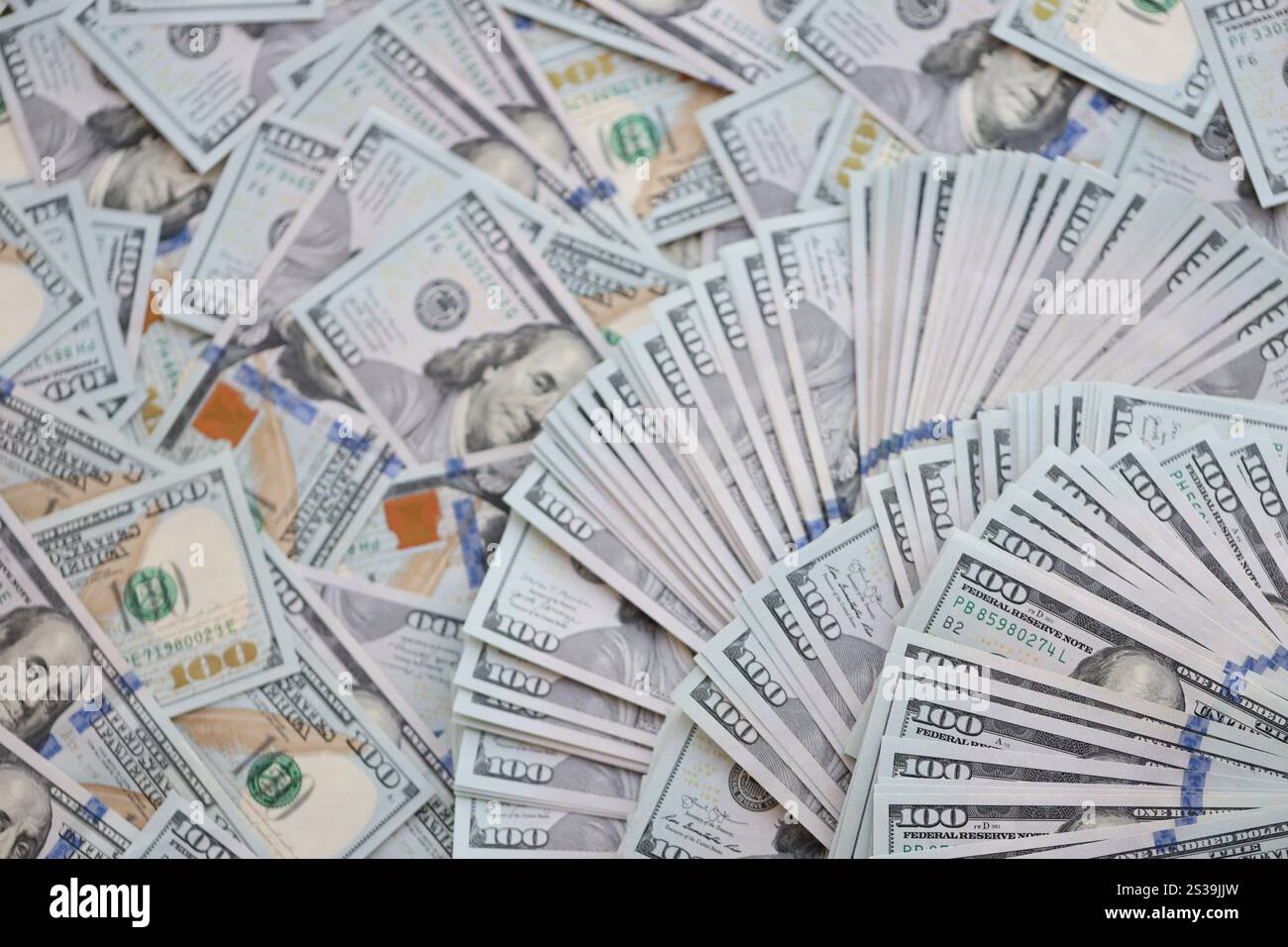 Very big amount of US hundred dollar bills close up. Huge quantity of ...