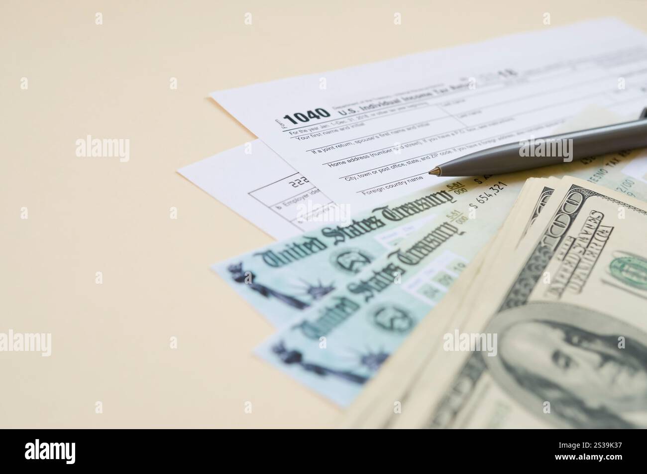 1040 Individual Income tax return form with Refund Check and hundred ...