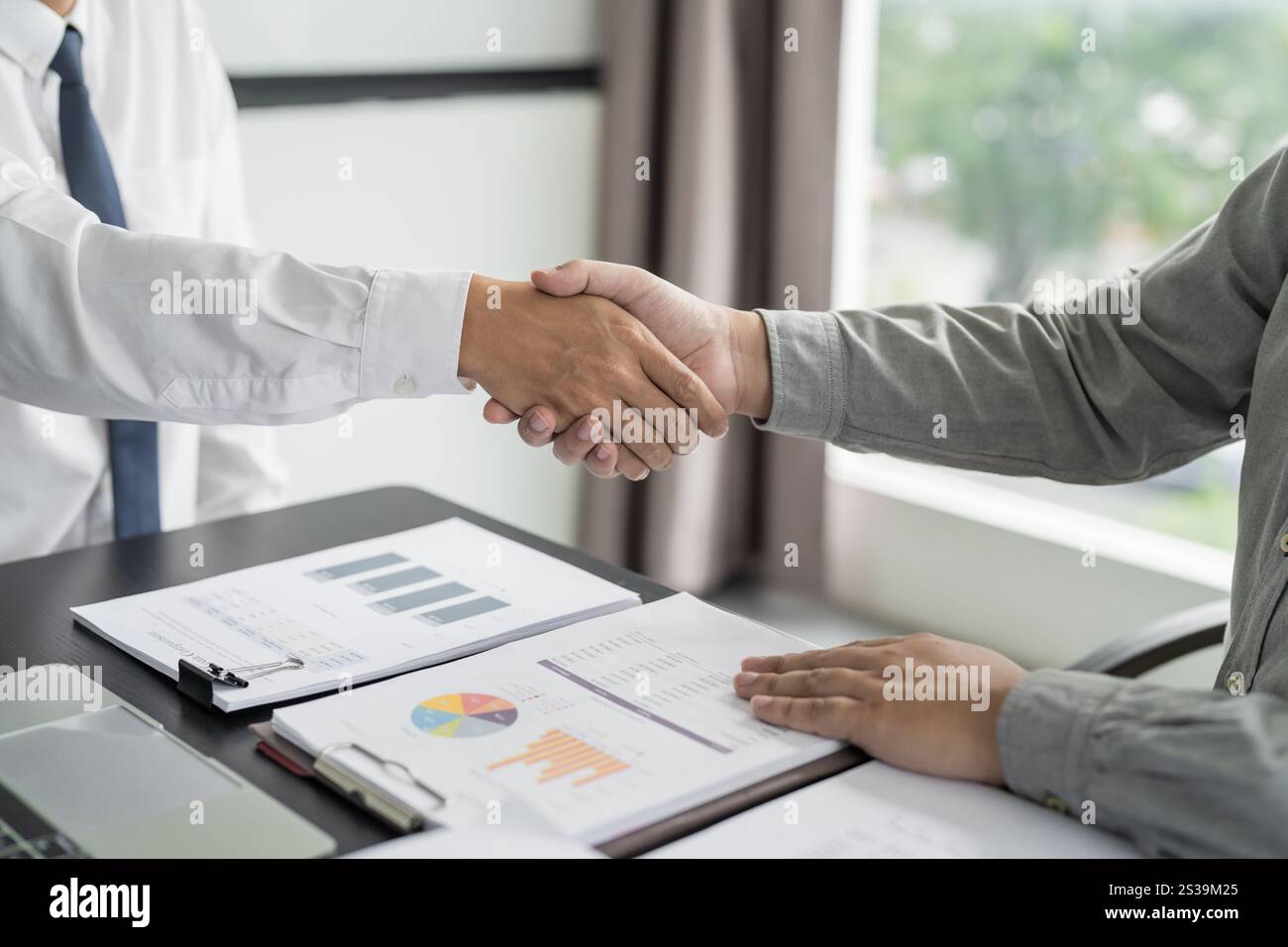 Businessman shaking hands successful making a deal. mans handshake. Business partnership meeting ...