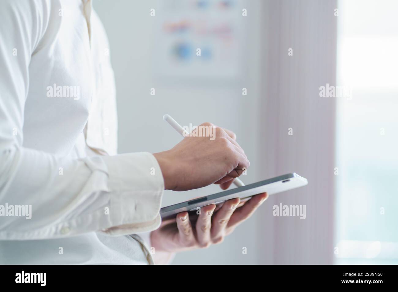 Businessman holding in hand tablet. hand pointing screen presented in ...