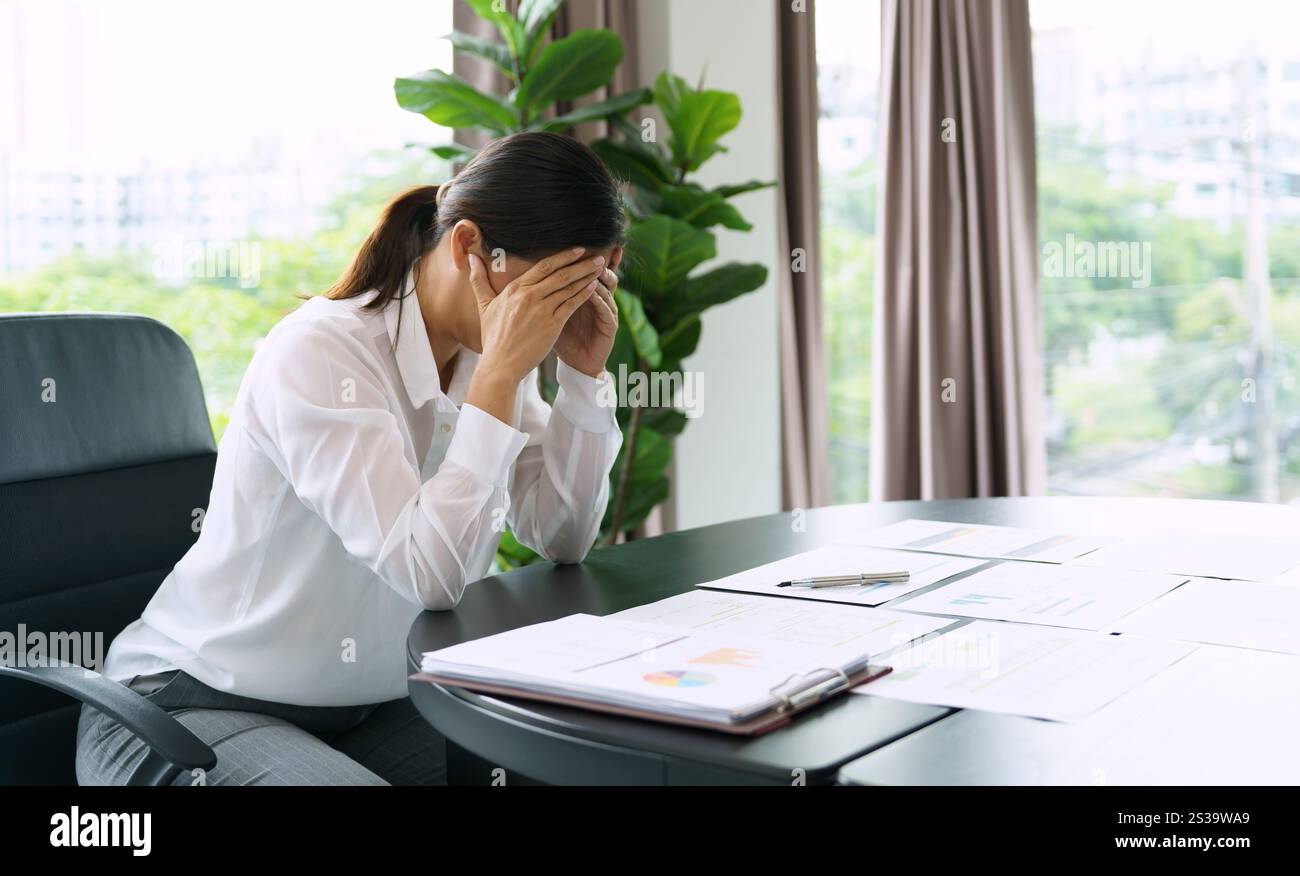 Burnout concept. Asian Business woman touching forehead having headache ...