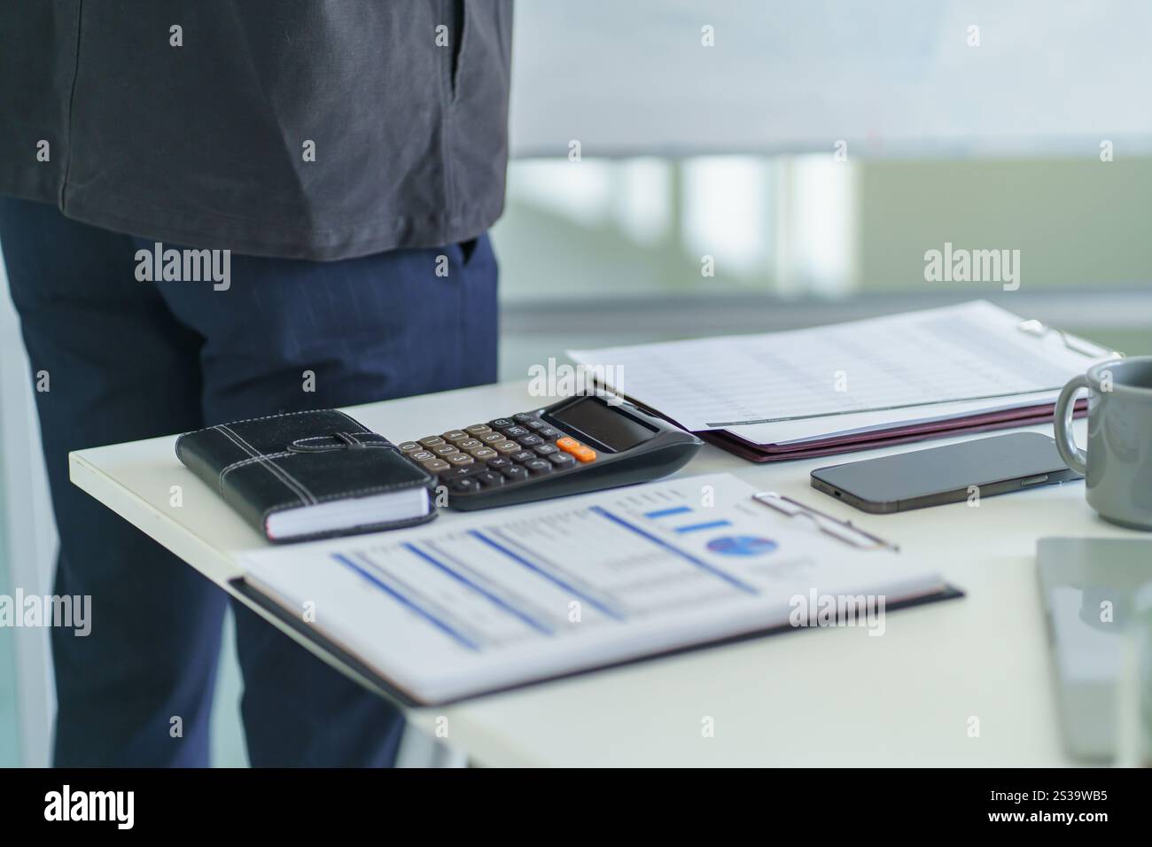 Young business man busy standing work at office. businessman using ...