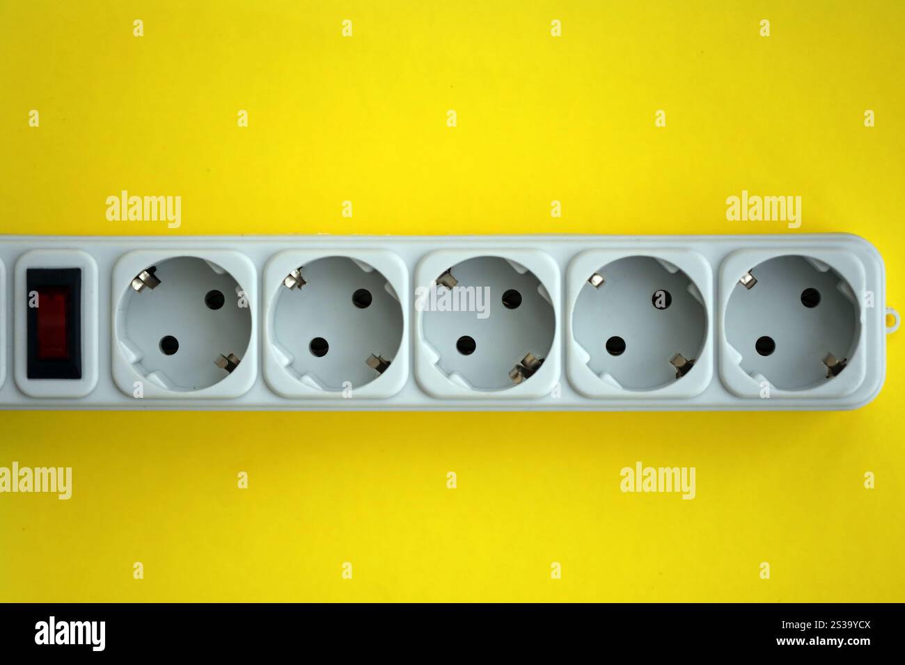 White electrical multi plug extender with european socket on bright ...