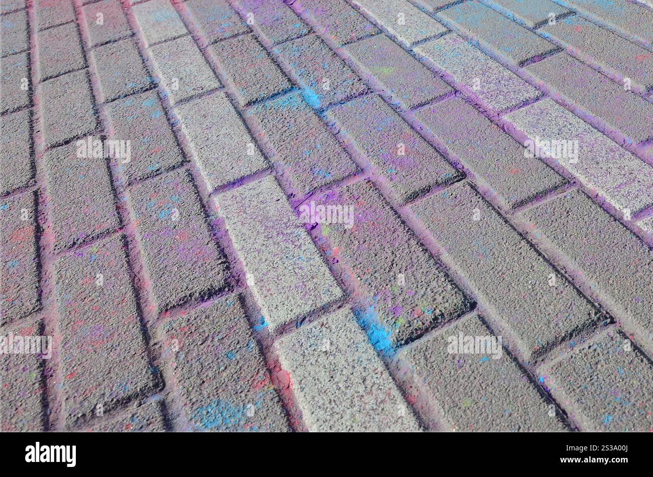 Multi colored earth, paving slabs, powder coated with dry colors at the Holi festival close up ...