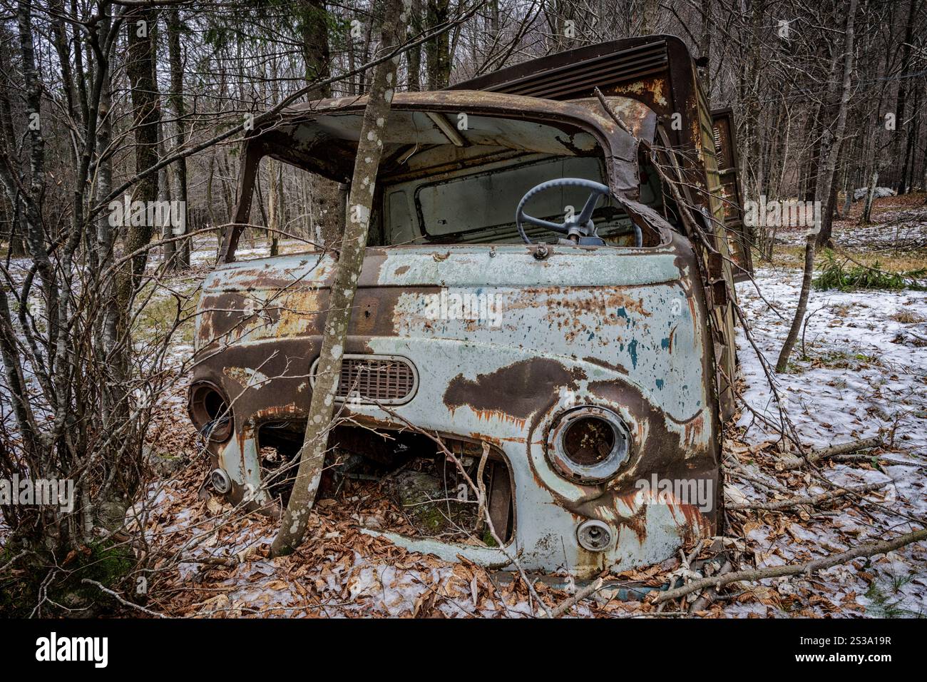 Old vintage rusty van abandoned on a snowy forest Stock Photo - Alamy
