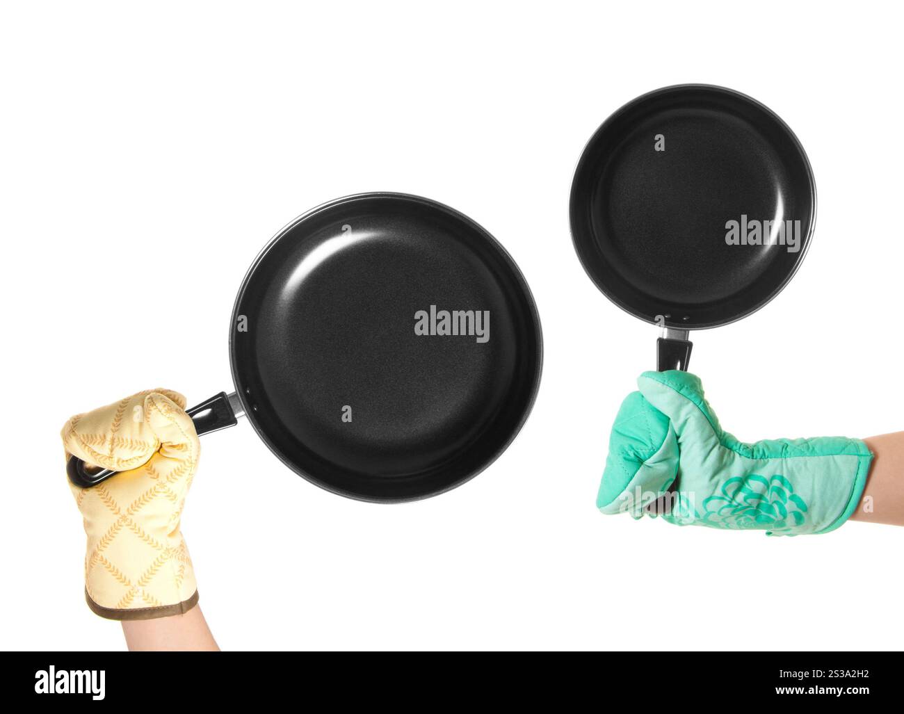 two hands in gloves holding pans isolated on white background. two ...