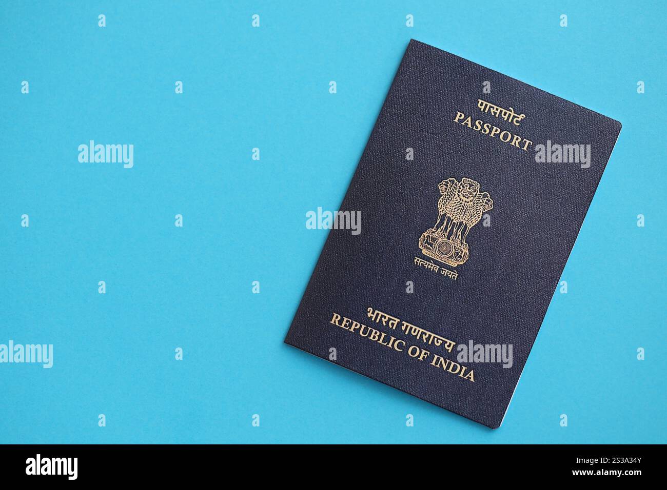 Blue Indian passport on blue background close up. Tourism and ...
