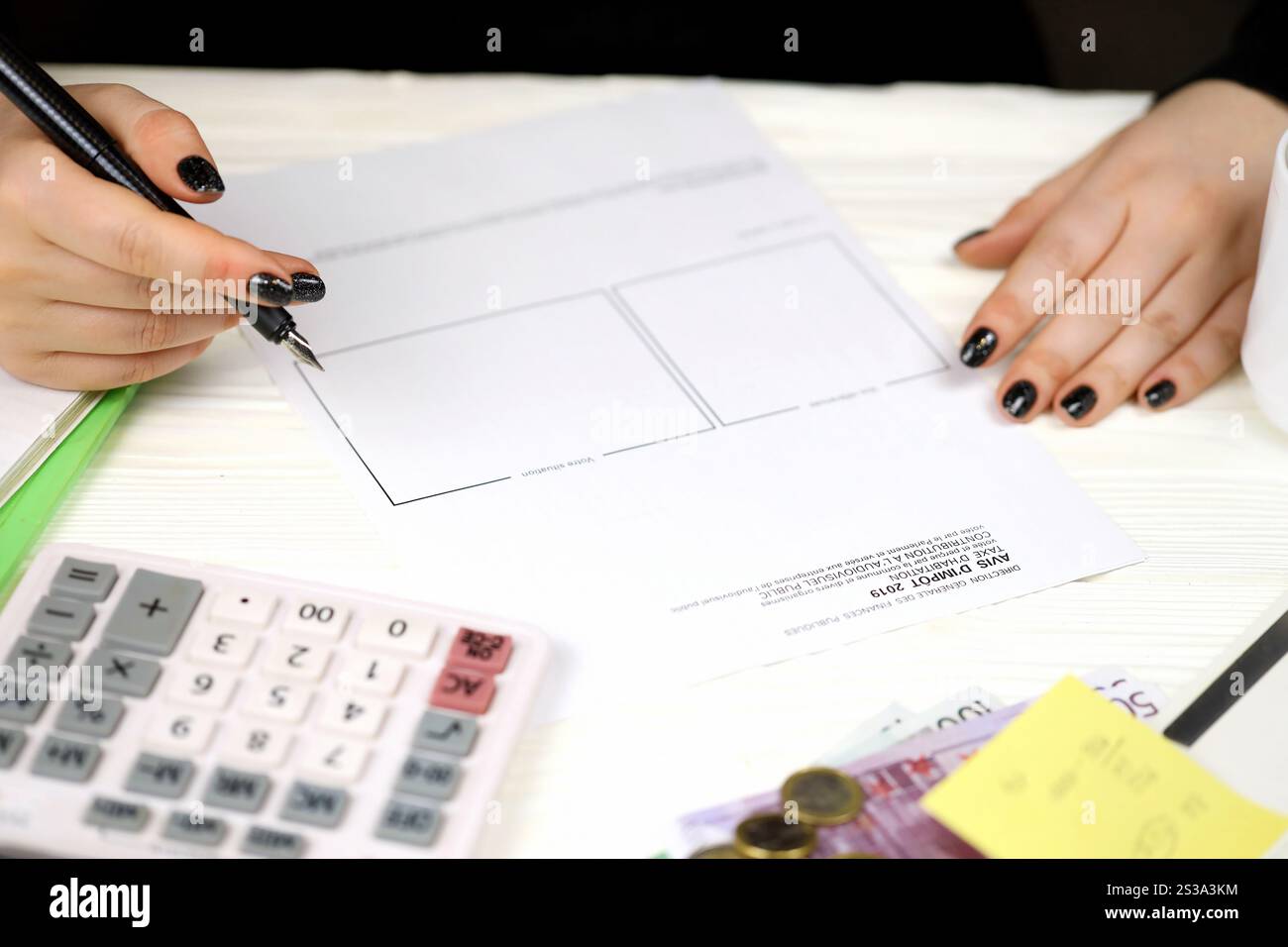 Accountant fill french tax form Notice of housing tax in end of tax ...