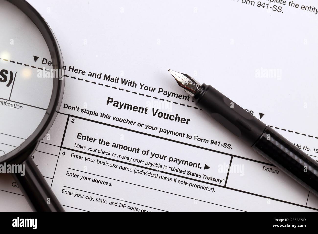 IRS Form 941-V Payment Voucher blank on A4 tablet lies on office table ...