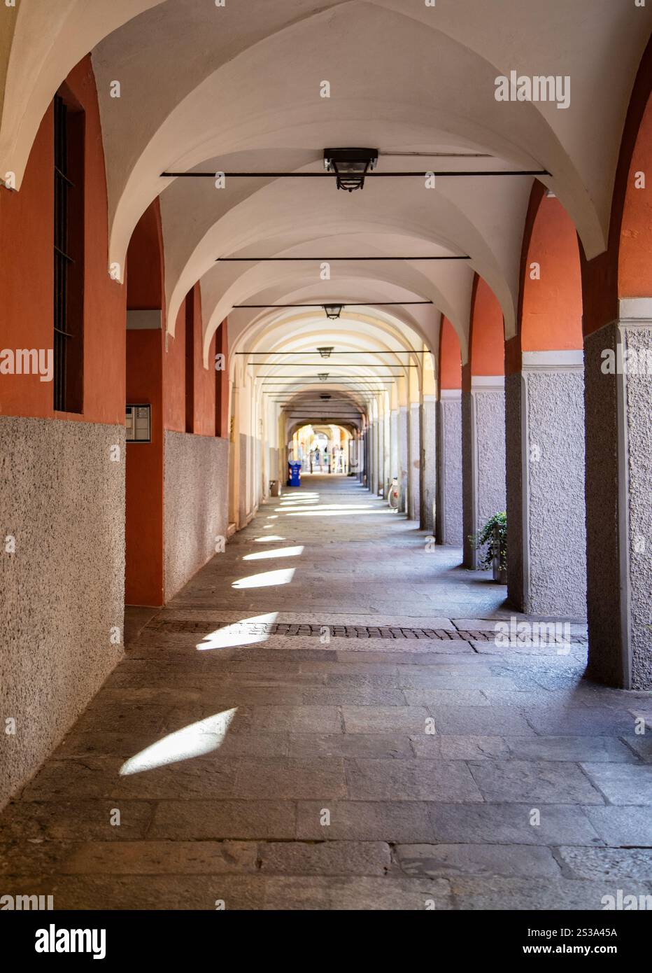 Classic ancient arcade with columns, Parma city alleyway, historic ...