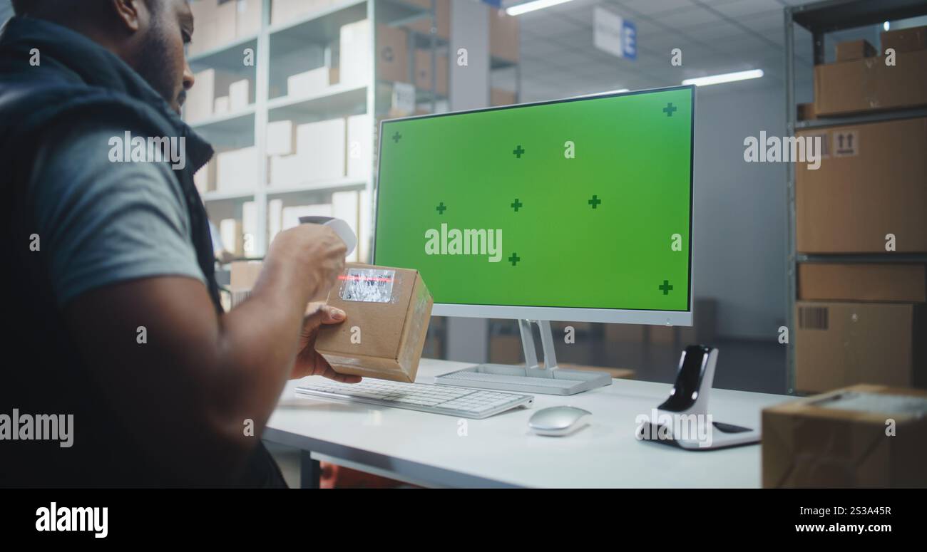 Delivery Service: African American Warehouse Associate Scans Code on ...