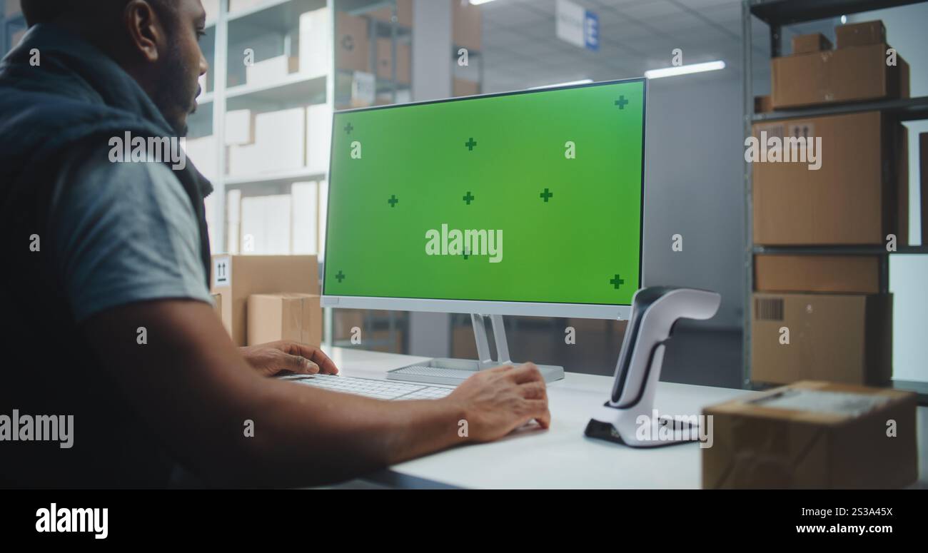 Delivery Service: African American Warehouse Associate Scans Code on ...