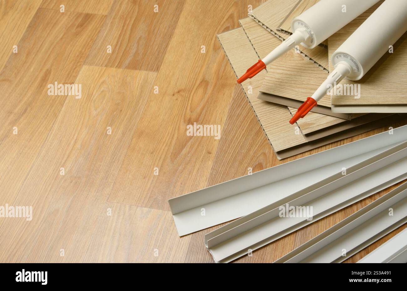 Set of items for PVC ceiling indoor works. Assembly adhesive bottles ...