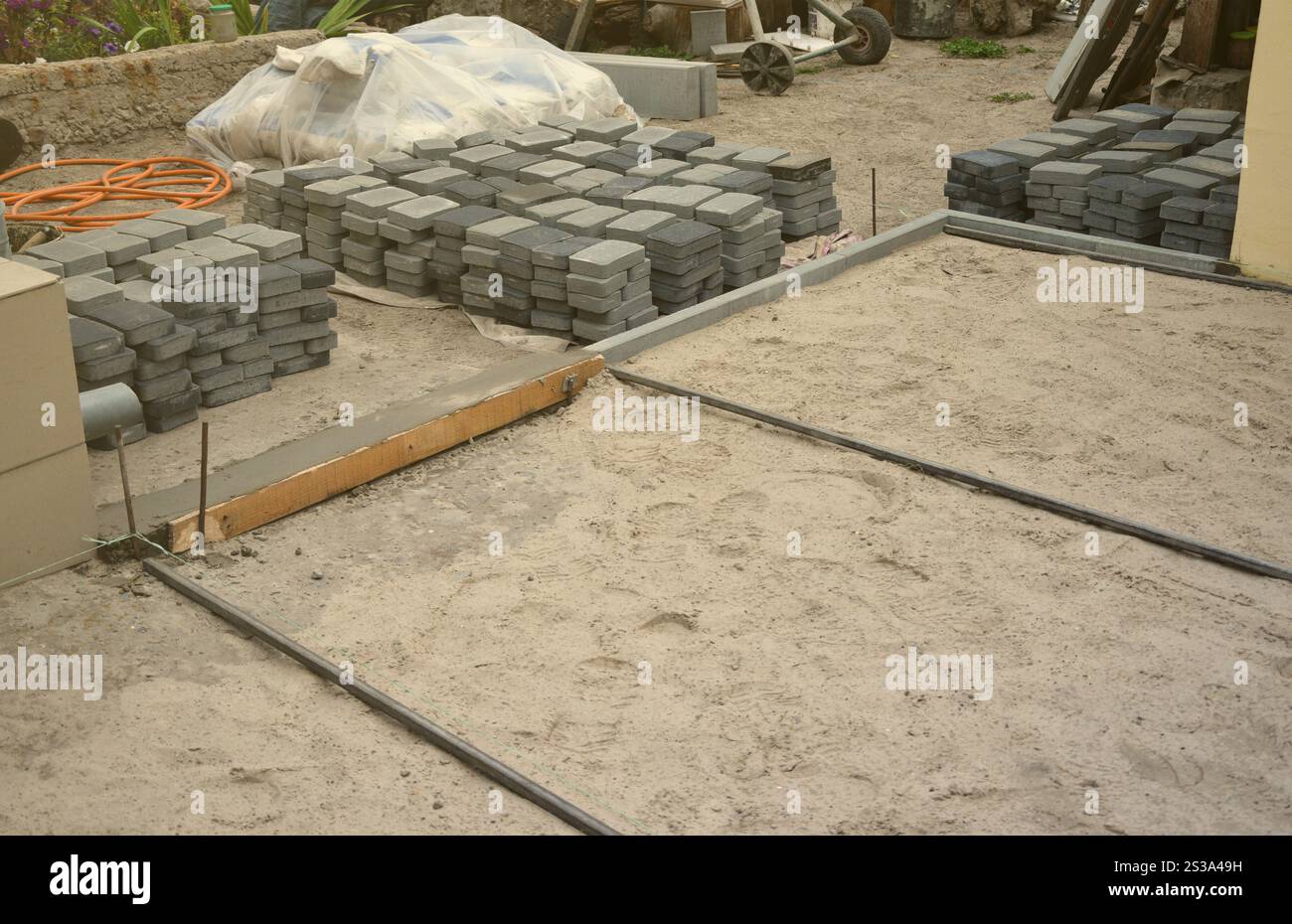 Rows of gray and dark grey walkway slab lying outdoors. Material for ...