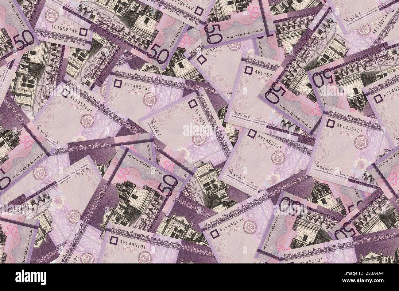 50 Dominican pesos bills lies in big pile. Rich life conceptual ...