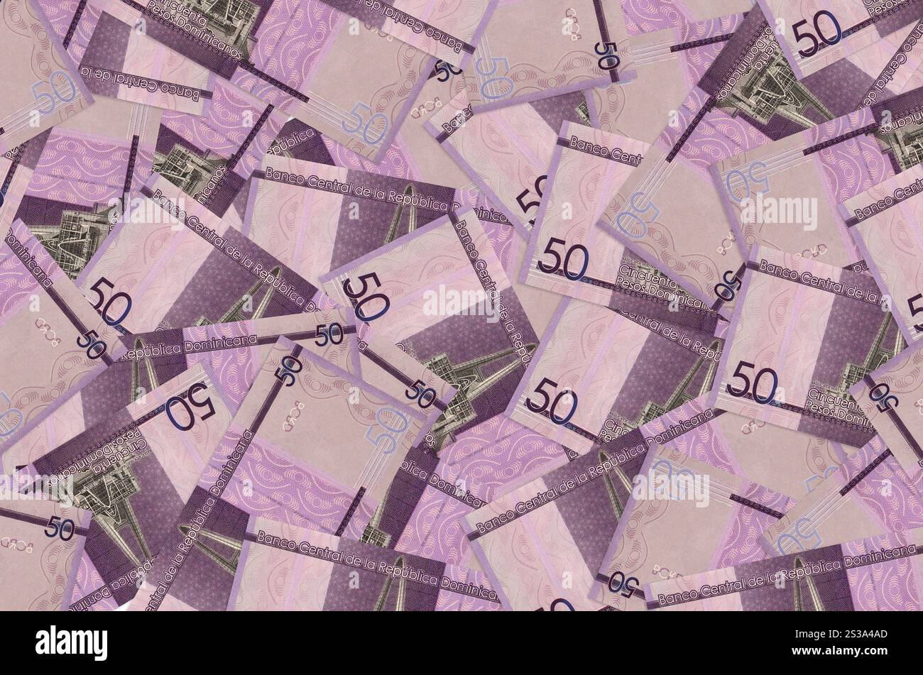 50 Dominican pesos bills lies in big pile. Rich life conceptual ...
