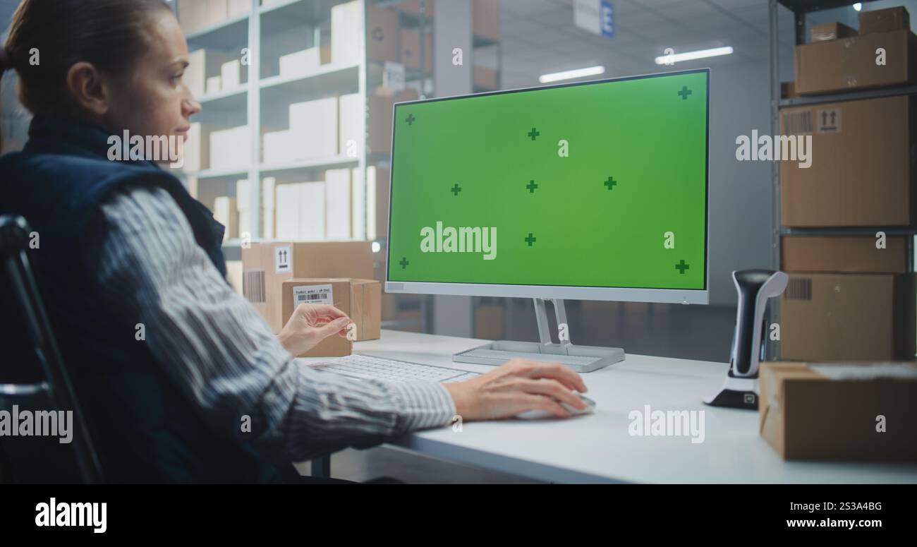 Distribution Center: Female Logistics Specialist Works on Computer in ...