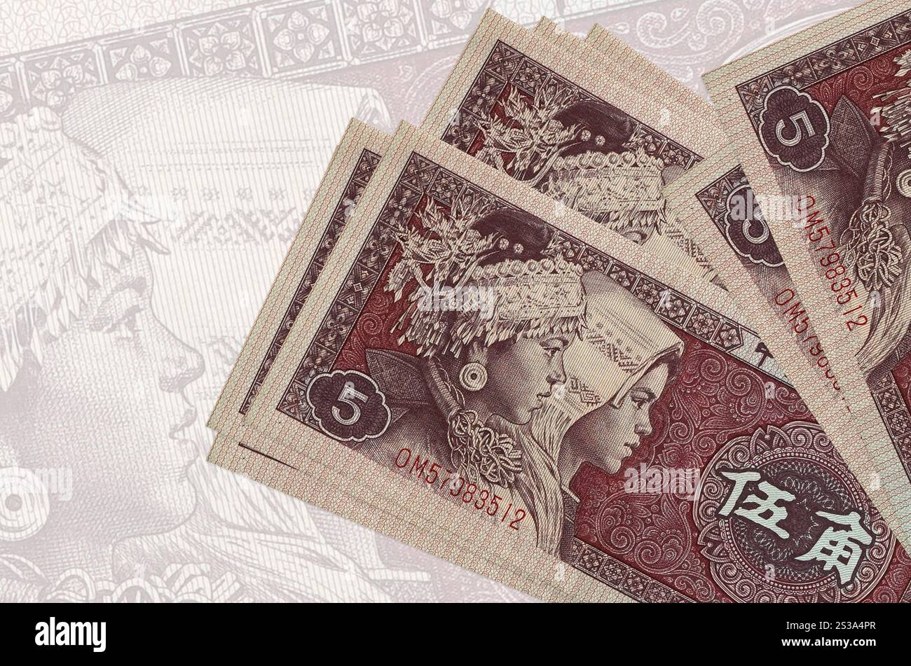 5 Chinese yuan bills lies in stack on background of big semi ...