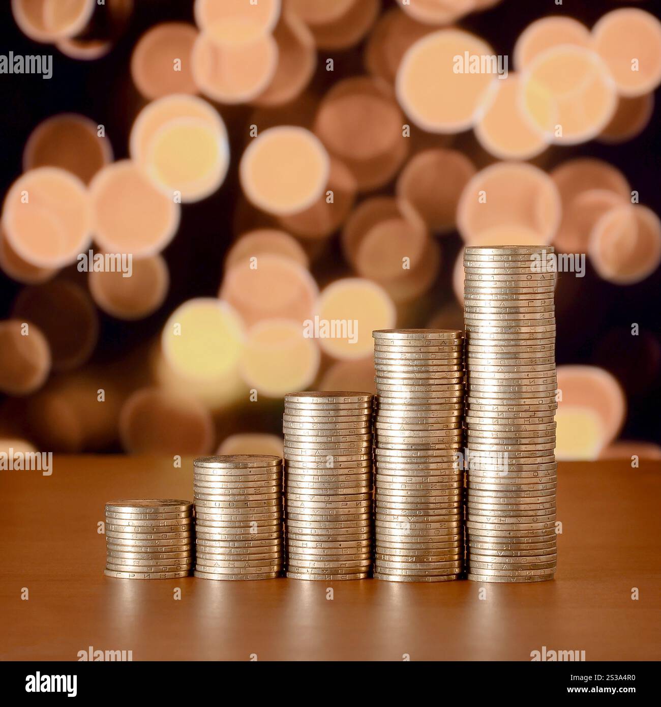 Golden coin stacks arranged as a graph. Increasing columns of coins, step of stacks coin ...