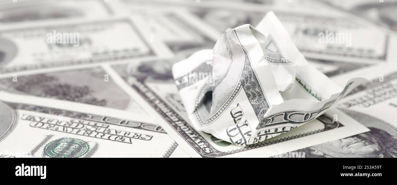 Crumpled dollar bill of the United States lies on the set of smooth ...