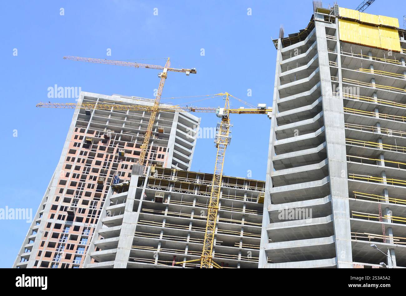 Construction site. High rise multi storey buildings under construction ...