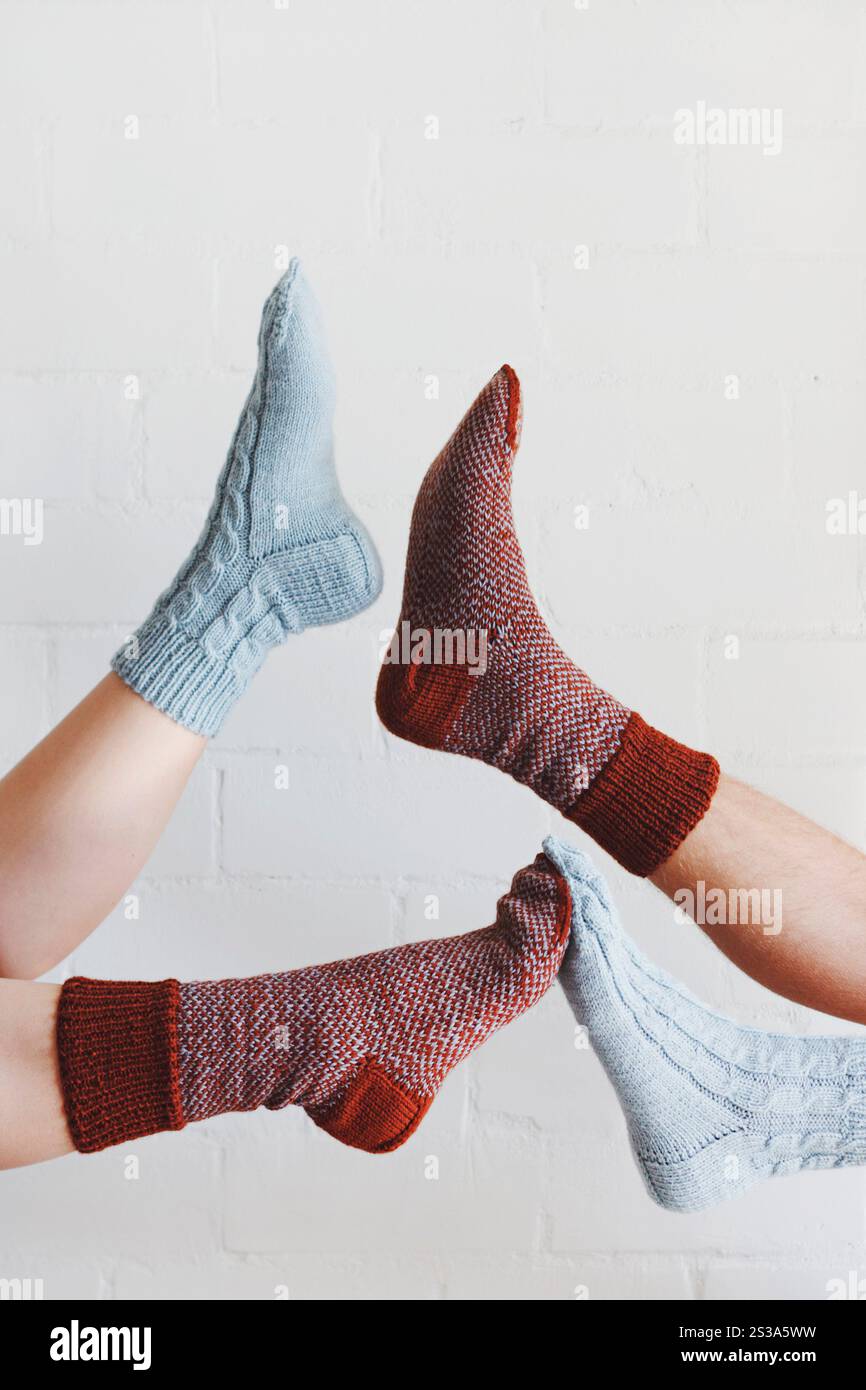 Legs with different socks on white wall Stock Photo - Alamy